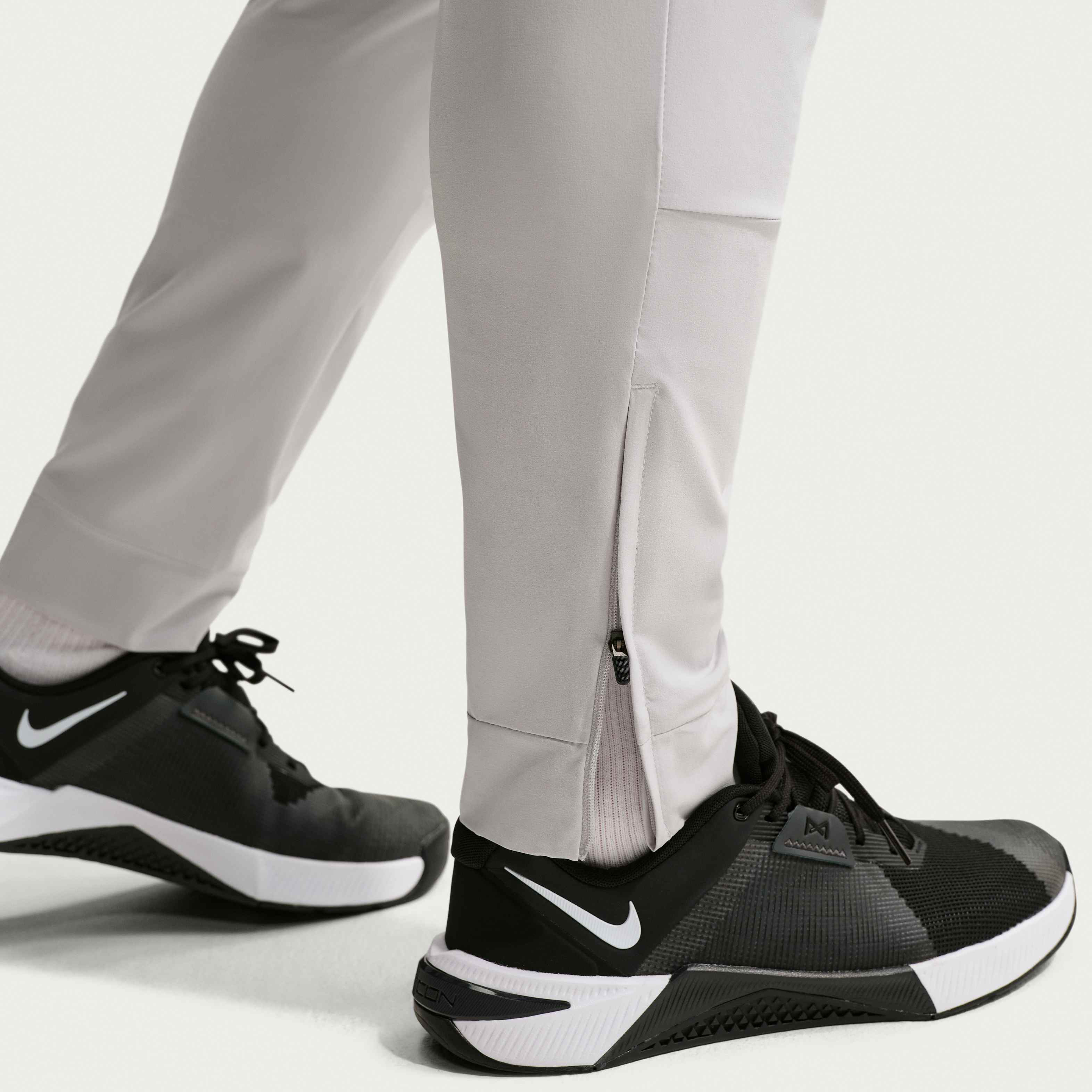 Buy Nike Unlimited Men's Dri-FIT Zip Cuff Versatile Trousers - Grey Fog ...
